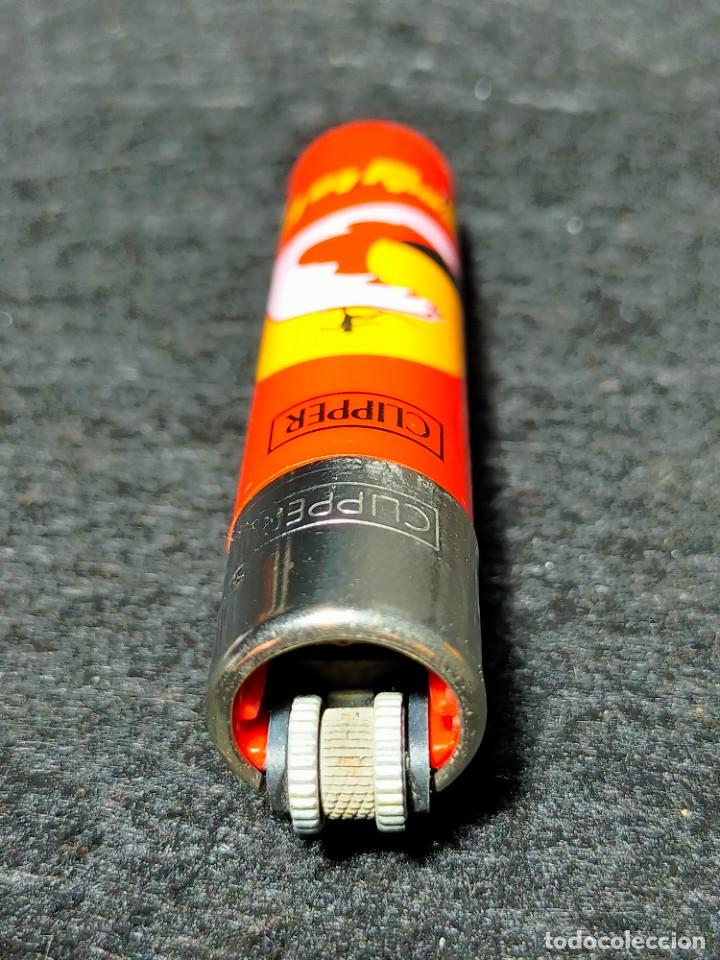 mechero clipper rojo surfeando la ola dibujo es - Comprar Mecheros ...